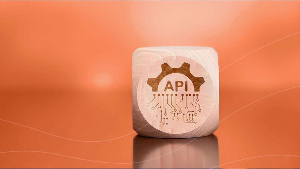 What is an API and what is its role in telecommunications?